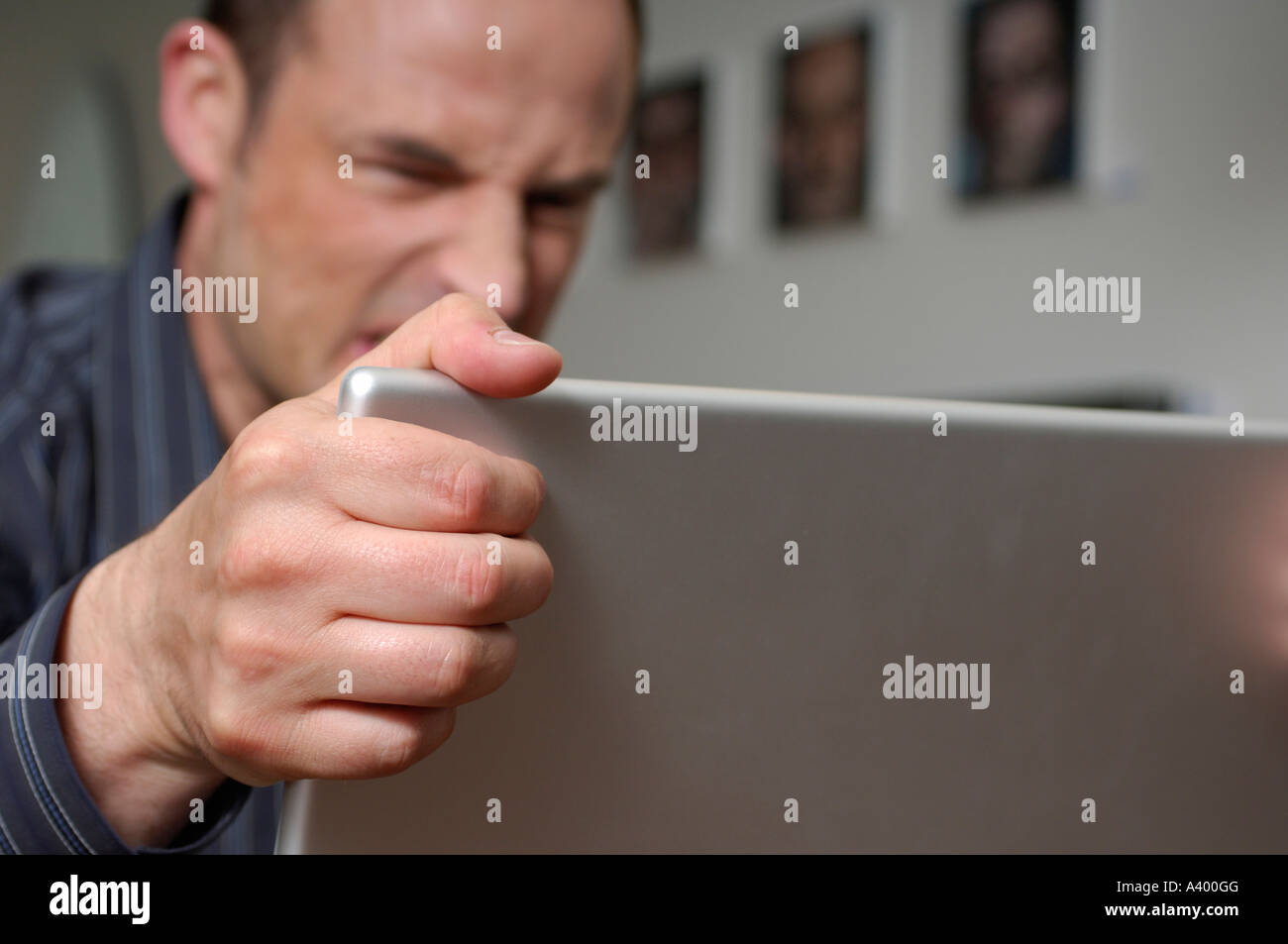 angry man with laptop computer Stock Photo - Alamy