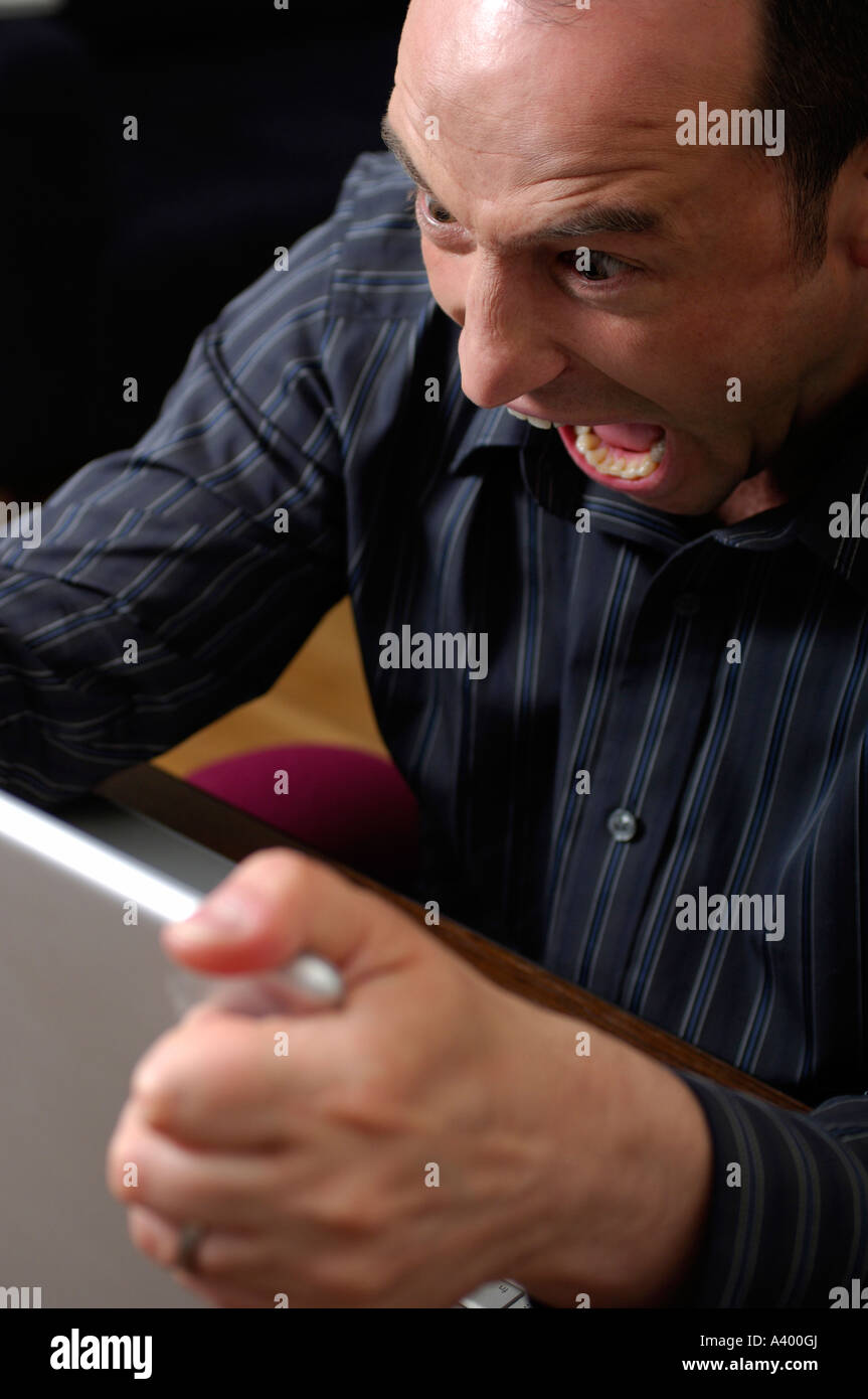 man shouting at computer screen Stock Photo - Alamy
