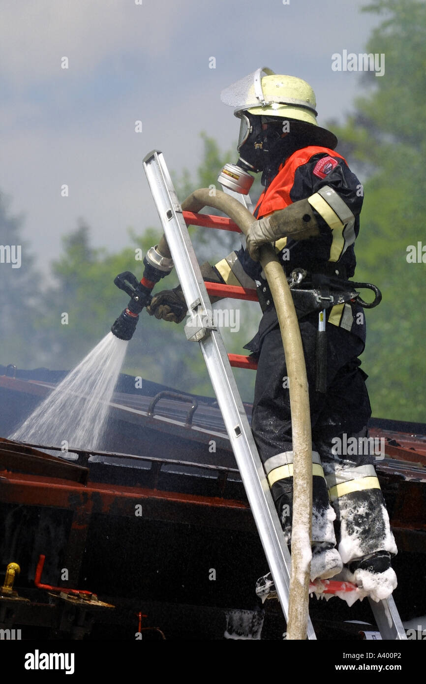 firemen extinguishing fire at a disaster practice train accident Stock ...