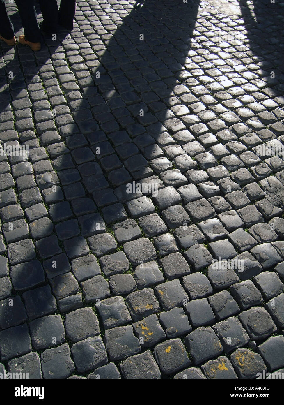 shadow on cobbled street Stock Photo - Alamy