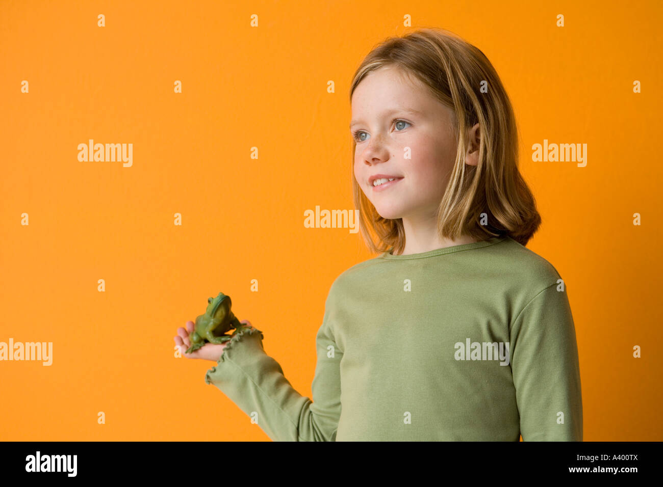 blonde girl holding frog Stock Photo - Alamy