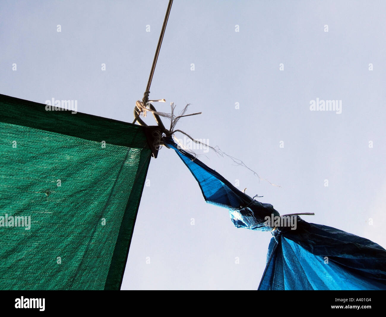 torn open air market stall canopy Stock Photo - Alamy