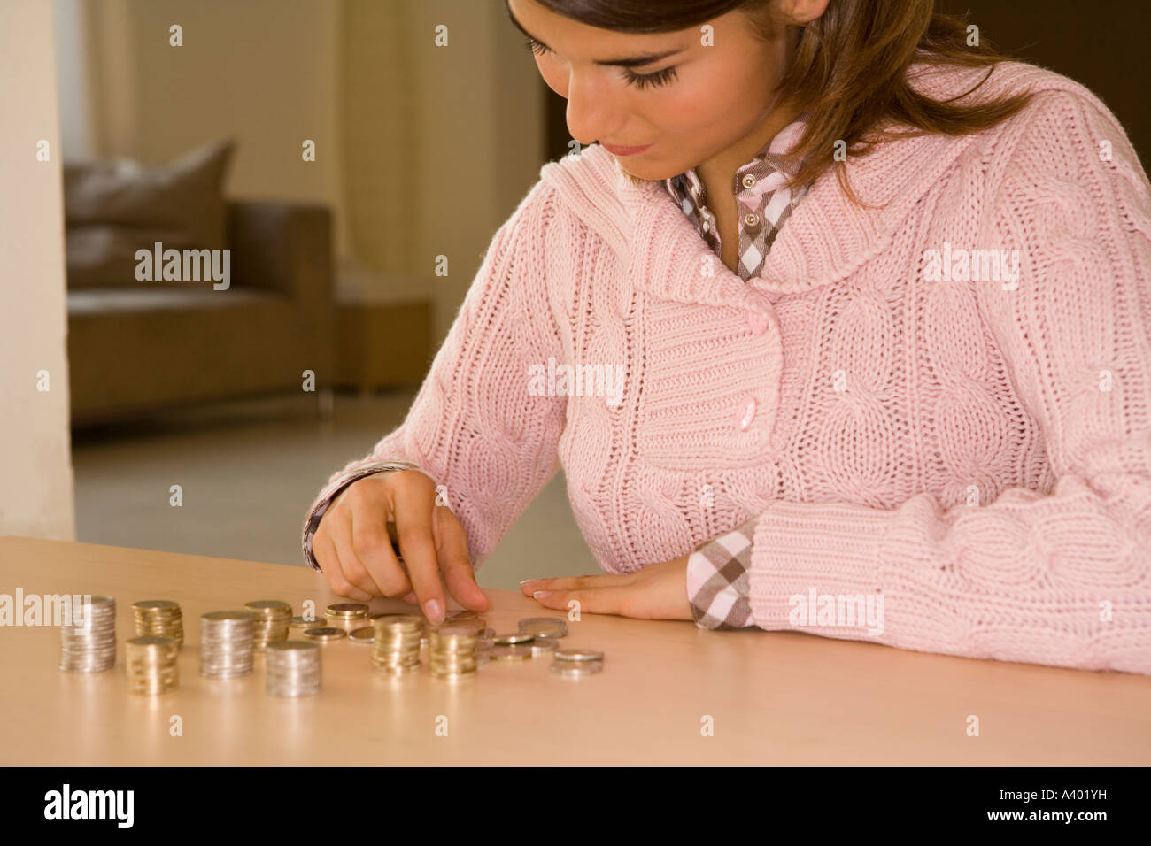 teenage girl sitting at home counting money Stock Photo - Alamy