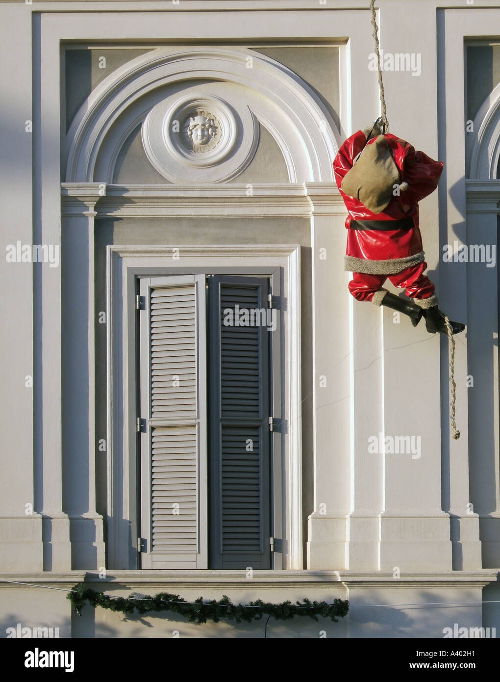 father christmas climbing rope Stock Photo - Alamy