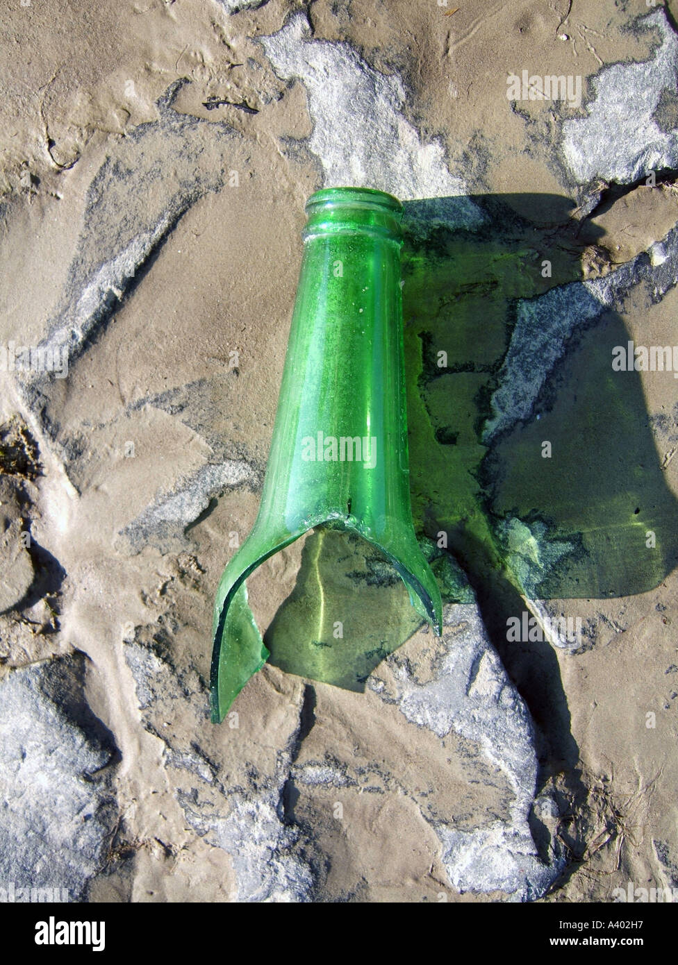 smashed green bottle on river bank Stock Photo - Alamy