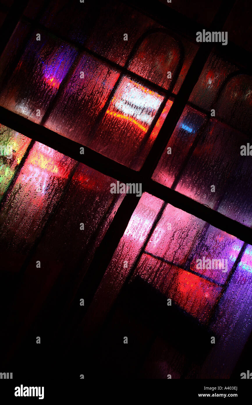 ABSTRACT Fishtail neon signmakers shop window at night Brighton East ...