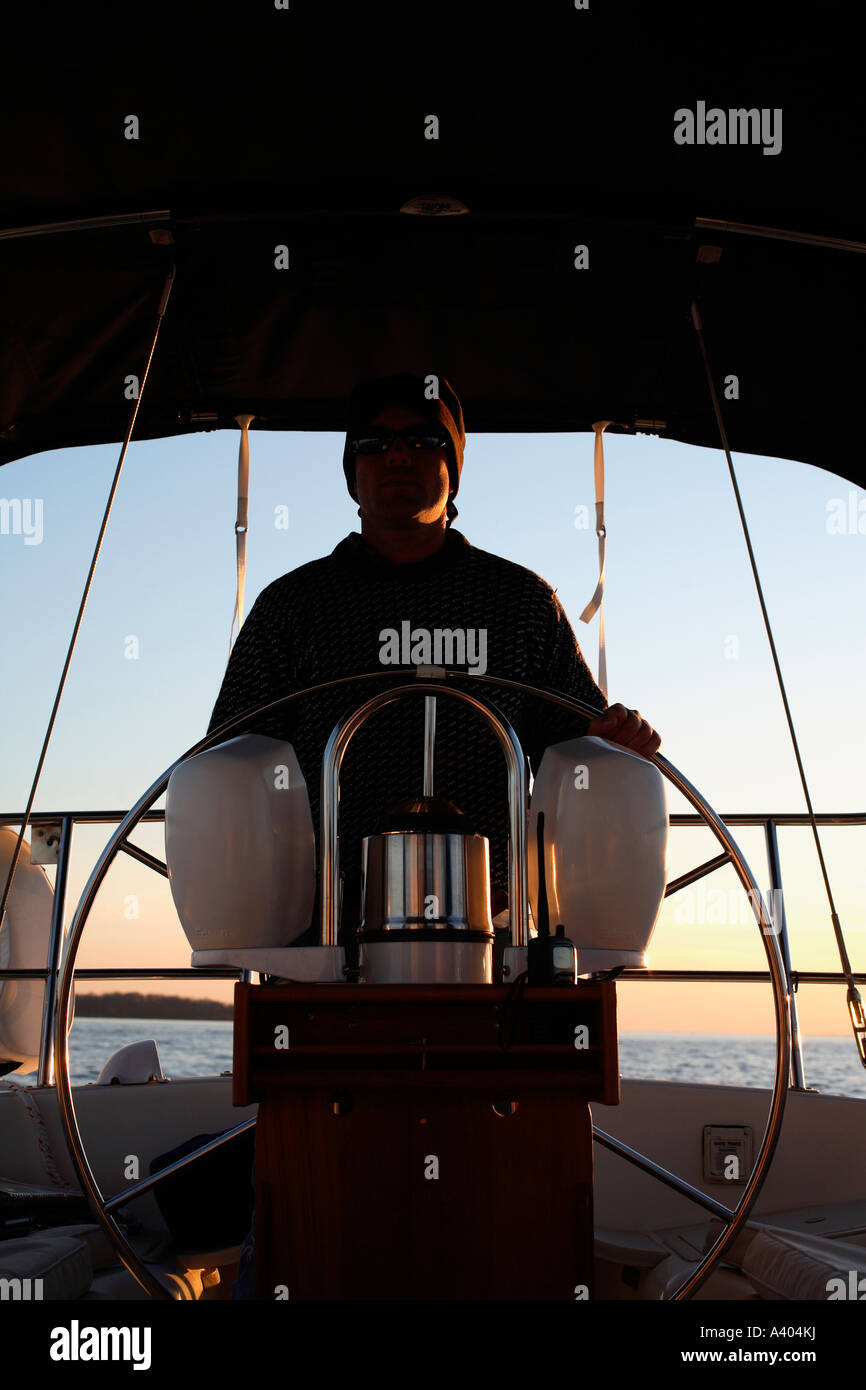 Boat captain at the wheel Stock Photo - Alamy