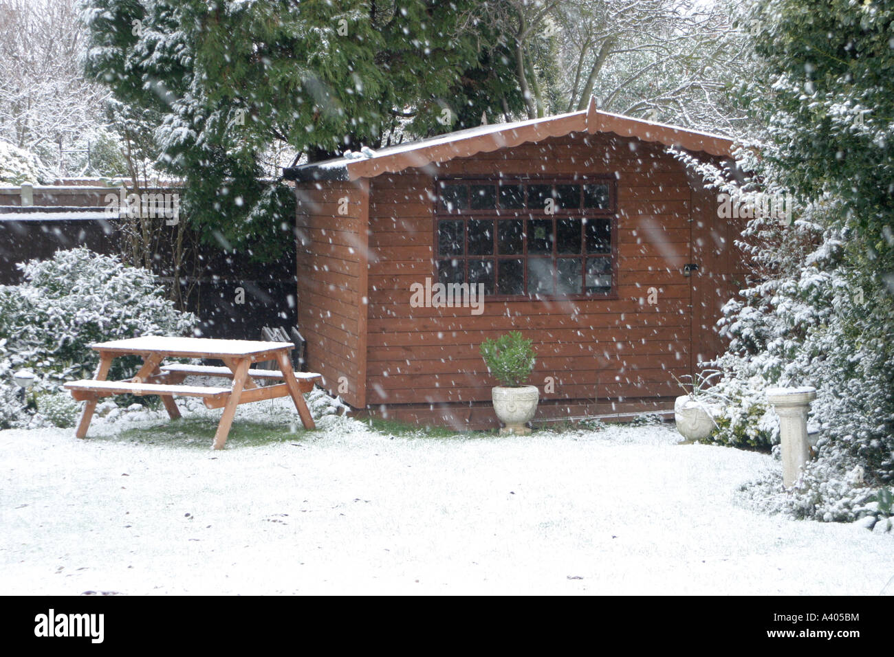 Snow covered garden and shed Stock Photo - Alamy