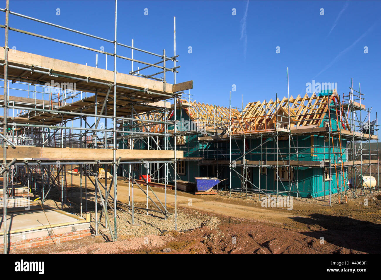 Scaffolding surrounds new homes being constructed on a new development ...
