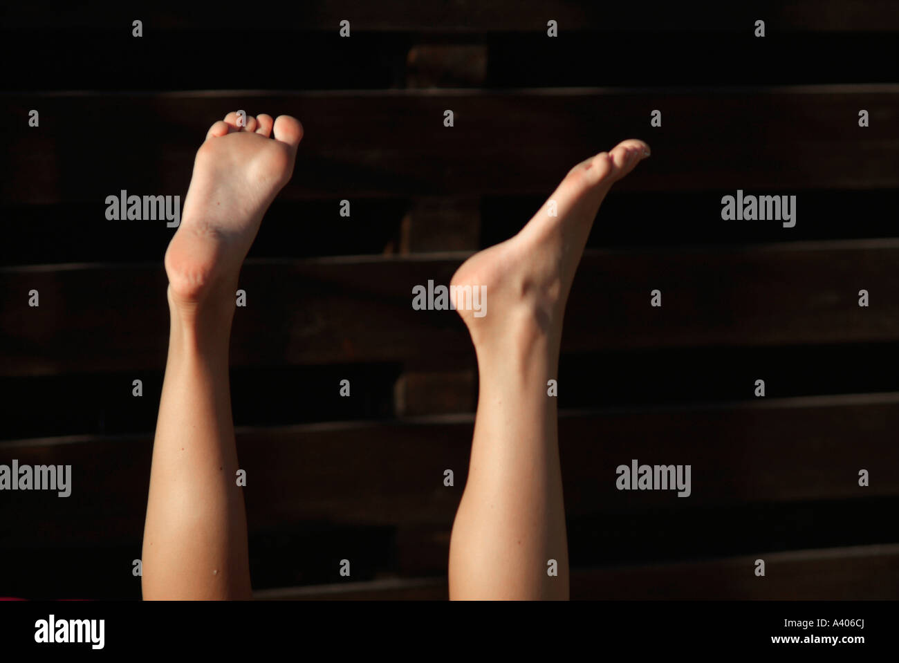 bare female feet and legs facing upwards Stock Photo - Alamy