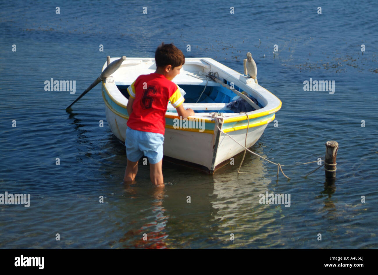 small boy with rowing boat Stock Photo - Alamy