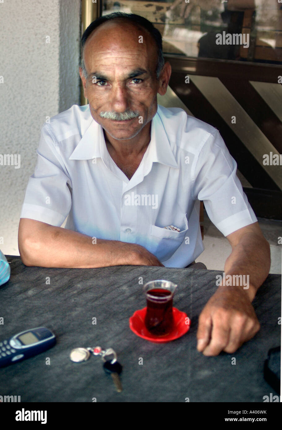 Middle aged Turkish village man with glass of tea Stock Photo - Alamy