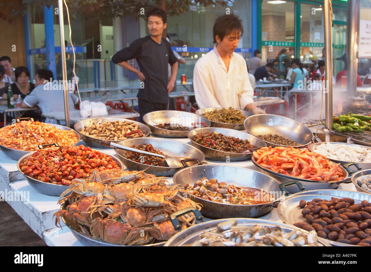 Chef Preparing Seafood At Food Stall Stock Photo - Alamy