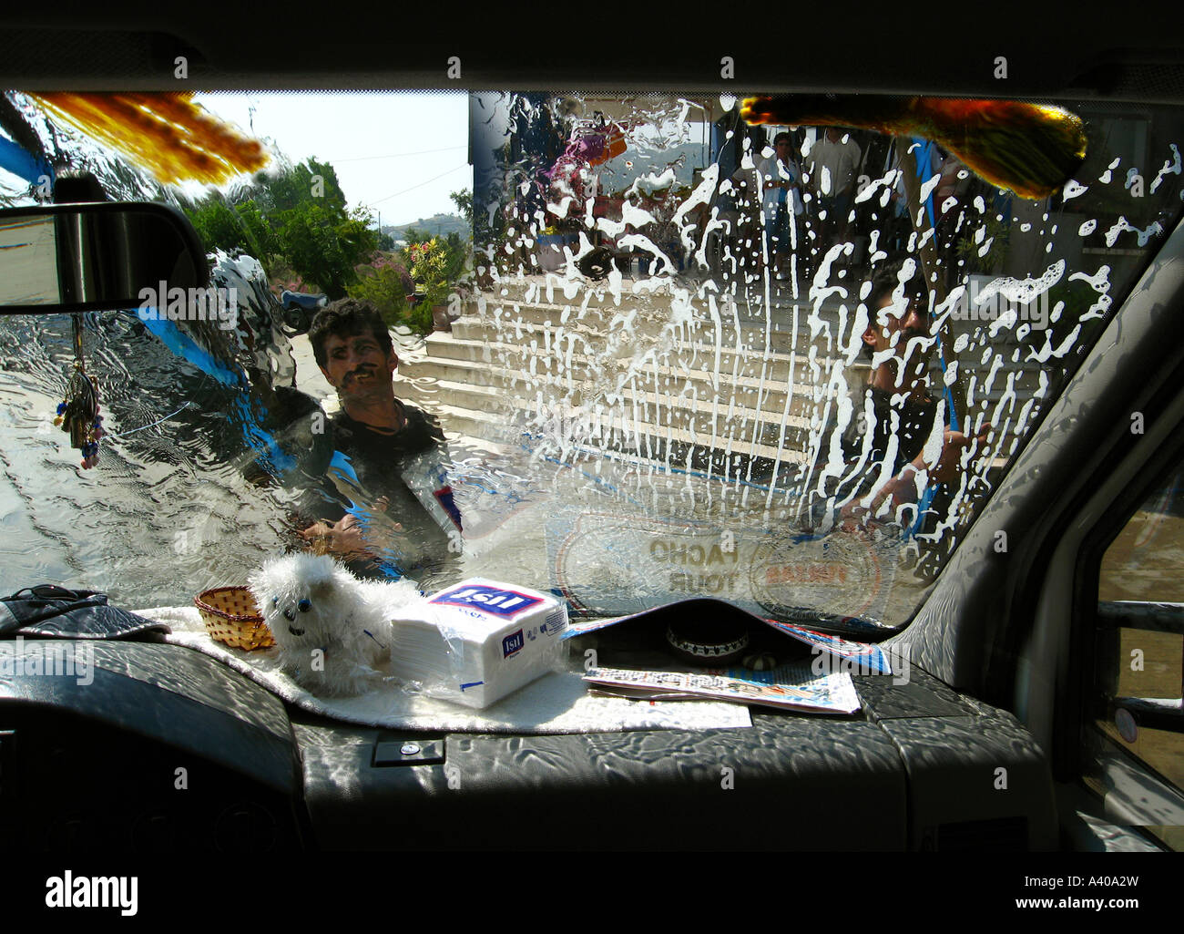 Man washing bus on bus stop Turkey Stock Photo - Alamy