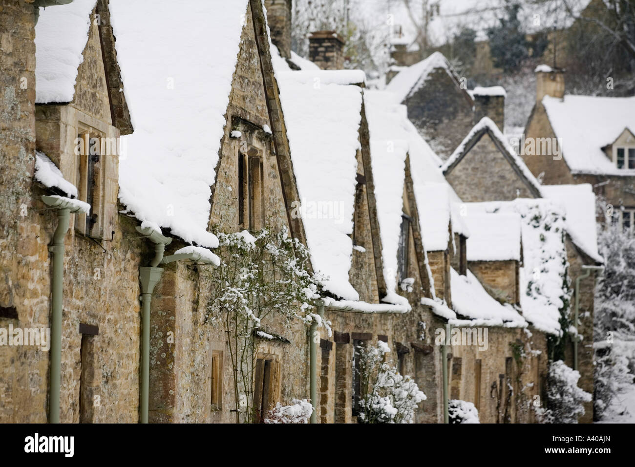 Medieval cottages at Arlington Row in the winter Bibury The Cotswolds ...