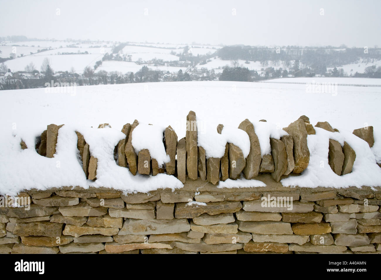 Winter Cotswolds landscape and Cotswold stone wall, Naunton ...