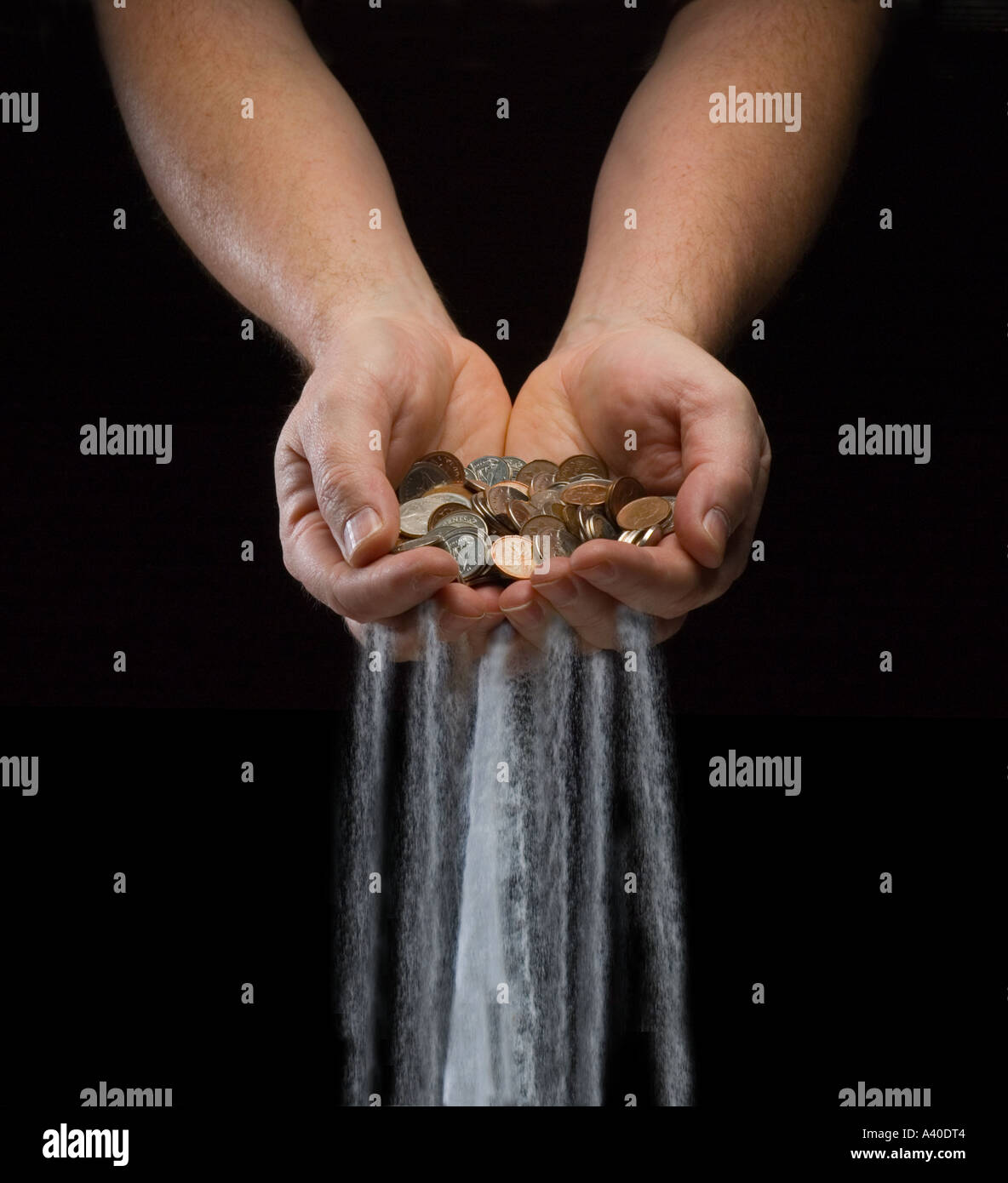Money through fingers hi-res stock photography and images - Alamy