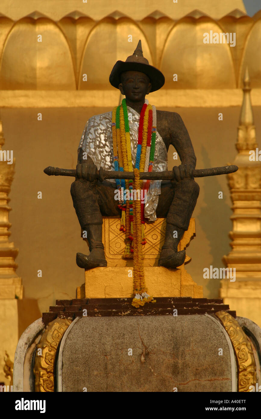 A statue of King Setthathirat sits directly in front of the entrance to ...