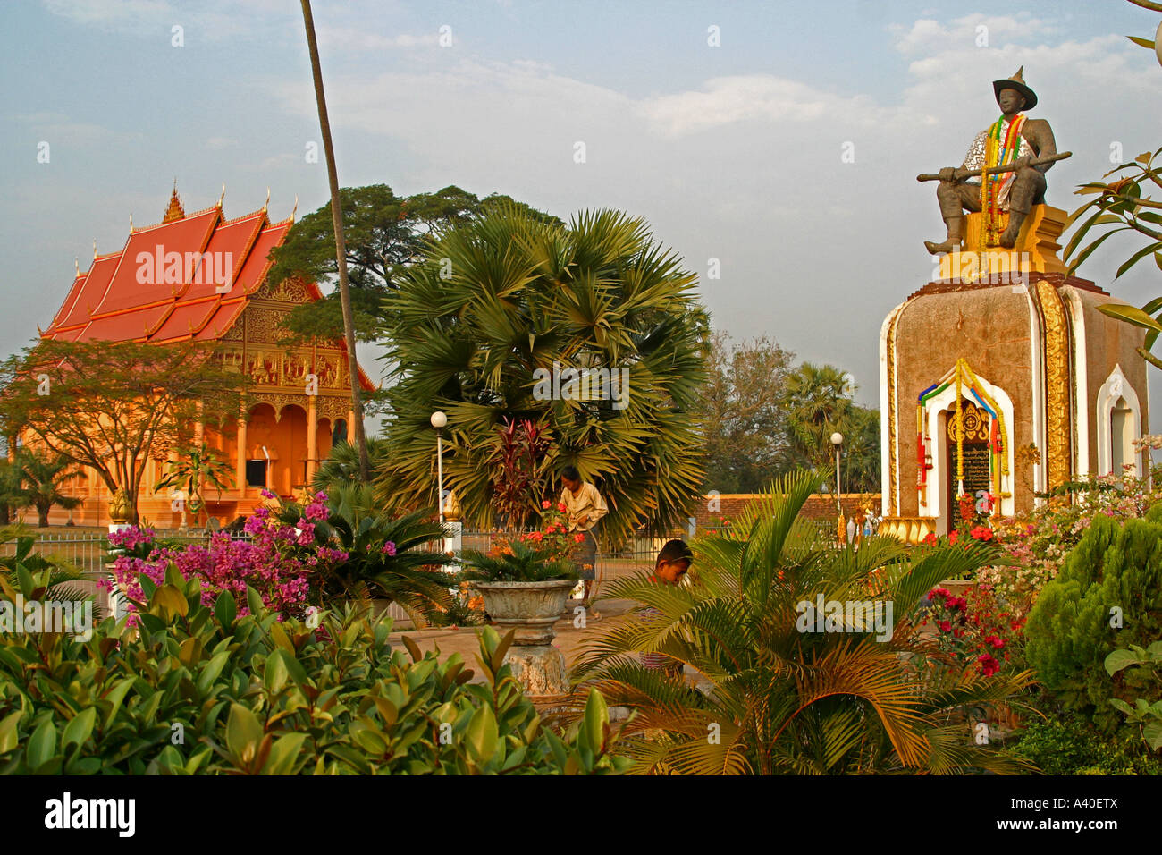 A statue of King Setthathirat sits directly in front of the entrance to ...