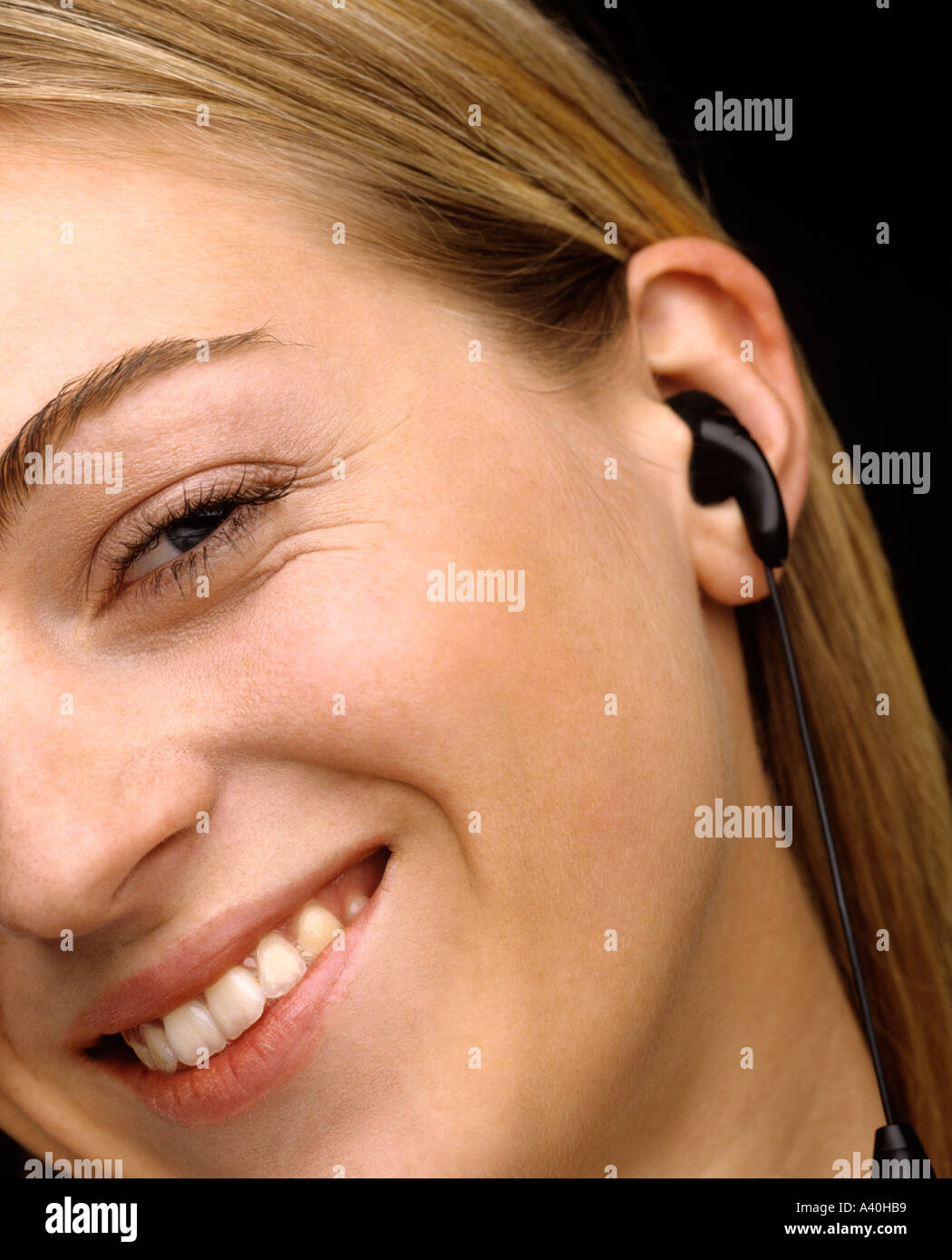 Woman earphone hi-res stock photography and images - Alamy