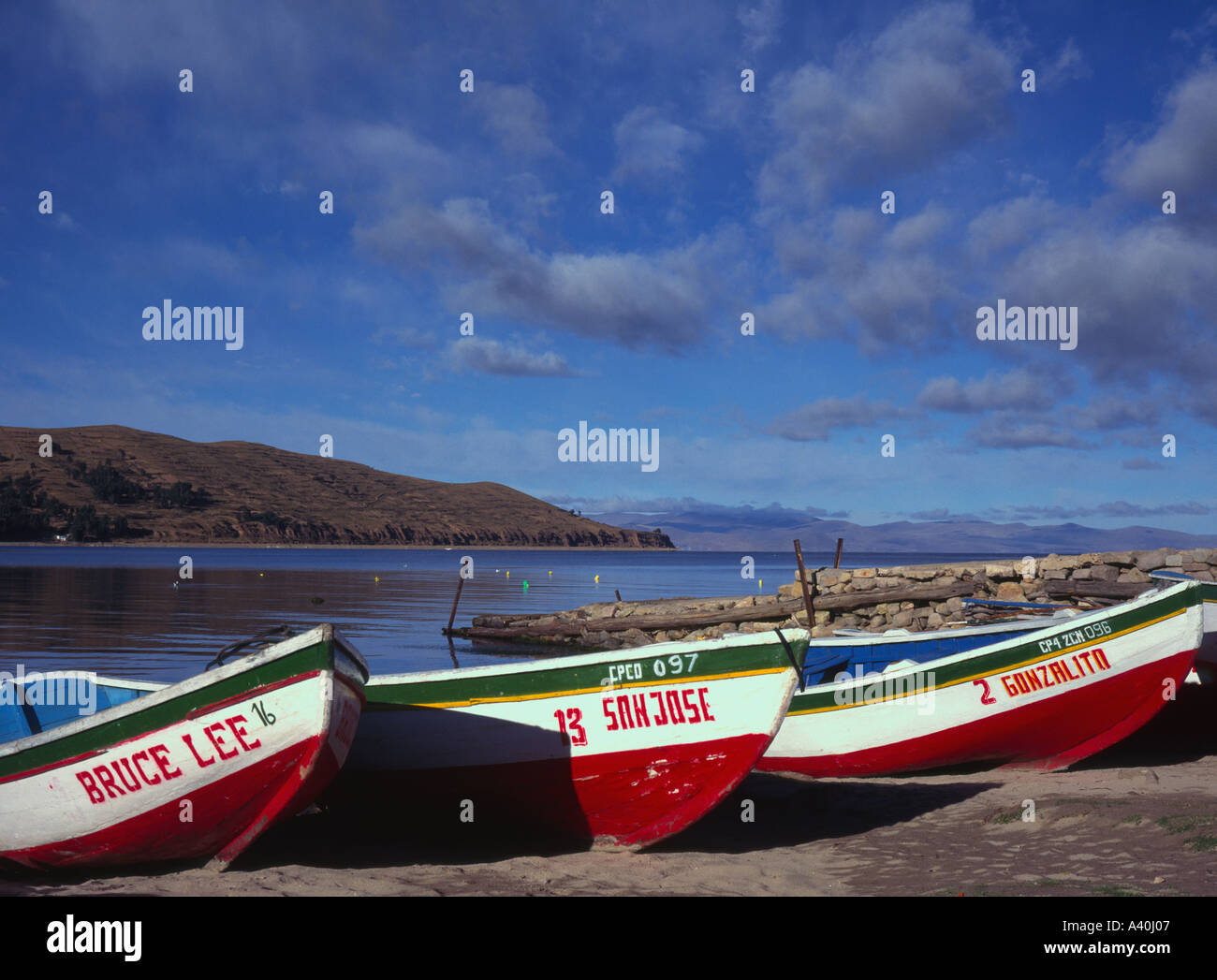 Bolivia lake Titicaca Copacabana 3 painted small fishing boatsat the ...