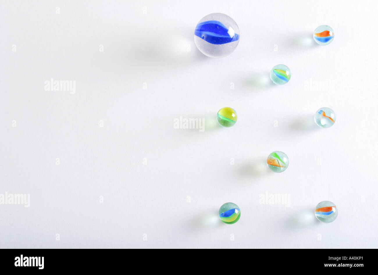 Eight marbles on a white background Stock Photo - Alamy