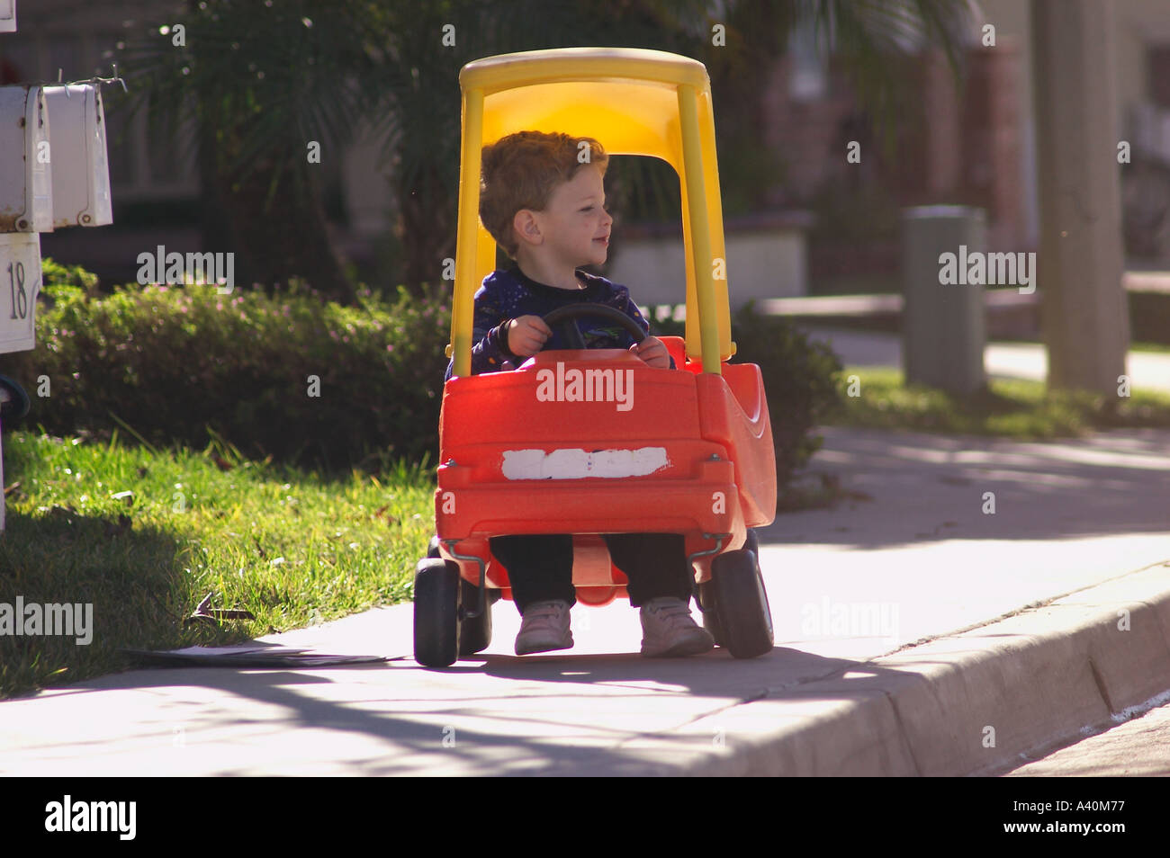 boy in toy car Stock Photo - Alamy