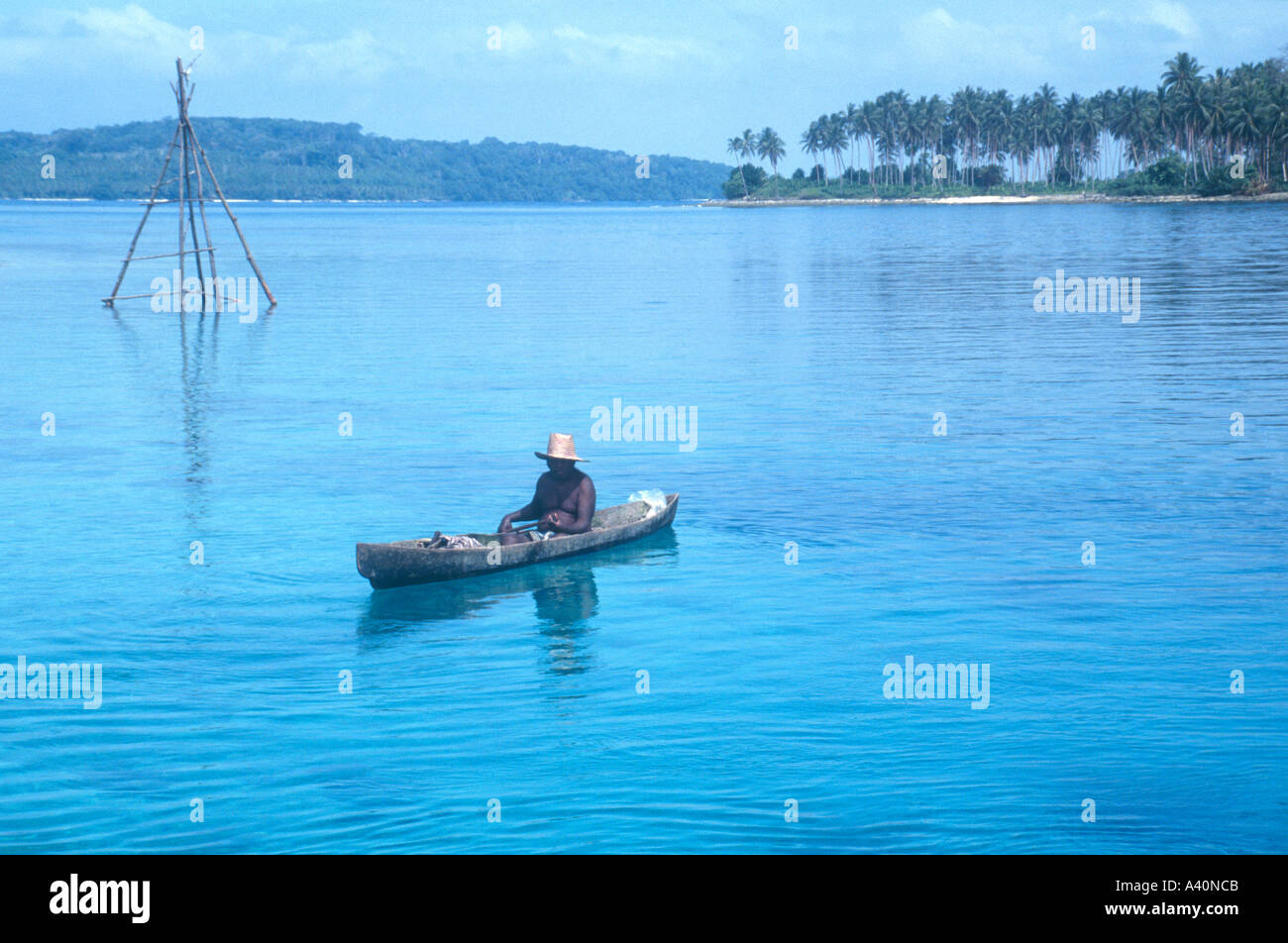 Solomon Islander in dugout canoe Stock Photo - Alamy