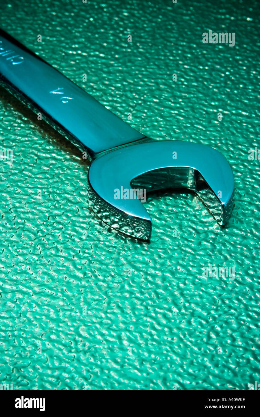 Single spanner against beaten copper background. Green lighting Stock ...