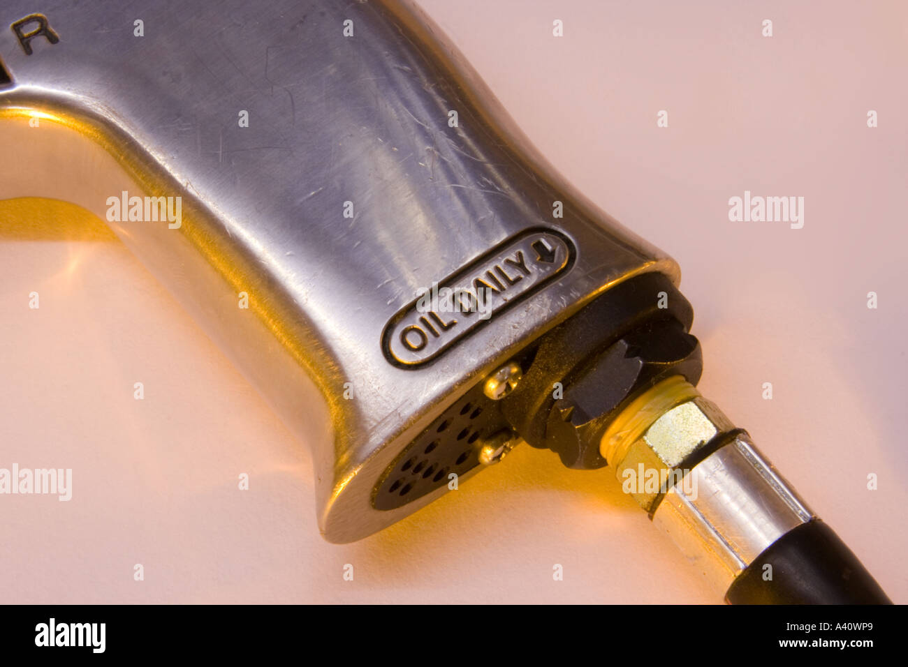 Hose and vent in handle of compressed air powered drill. Oil daily ...