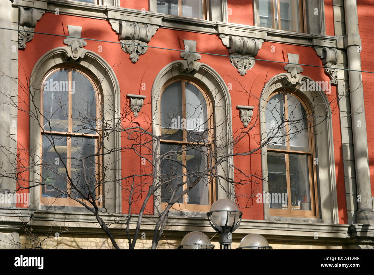 three windows in elegant building facade Stock Photo - Alamy