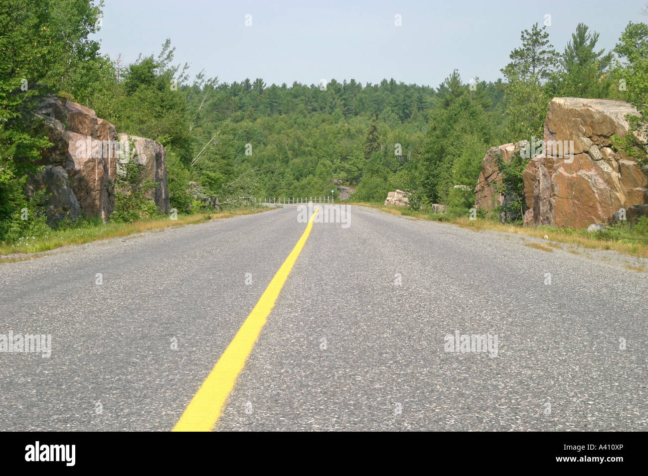 roadway with yellow center line Stock Photo - Alamy