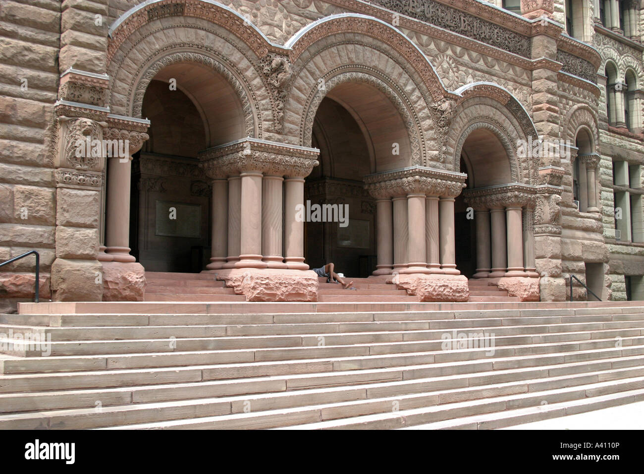 steps leading up to arches of building facade Stock Photo - Alamy
