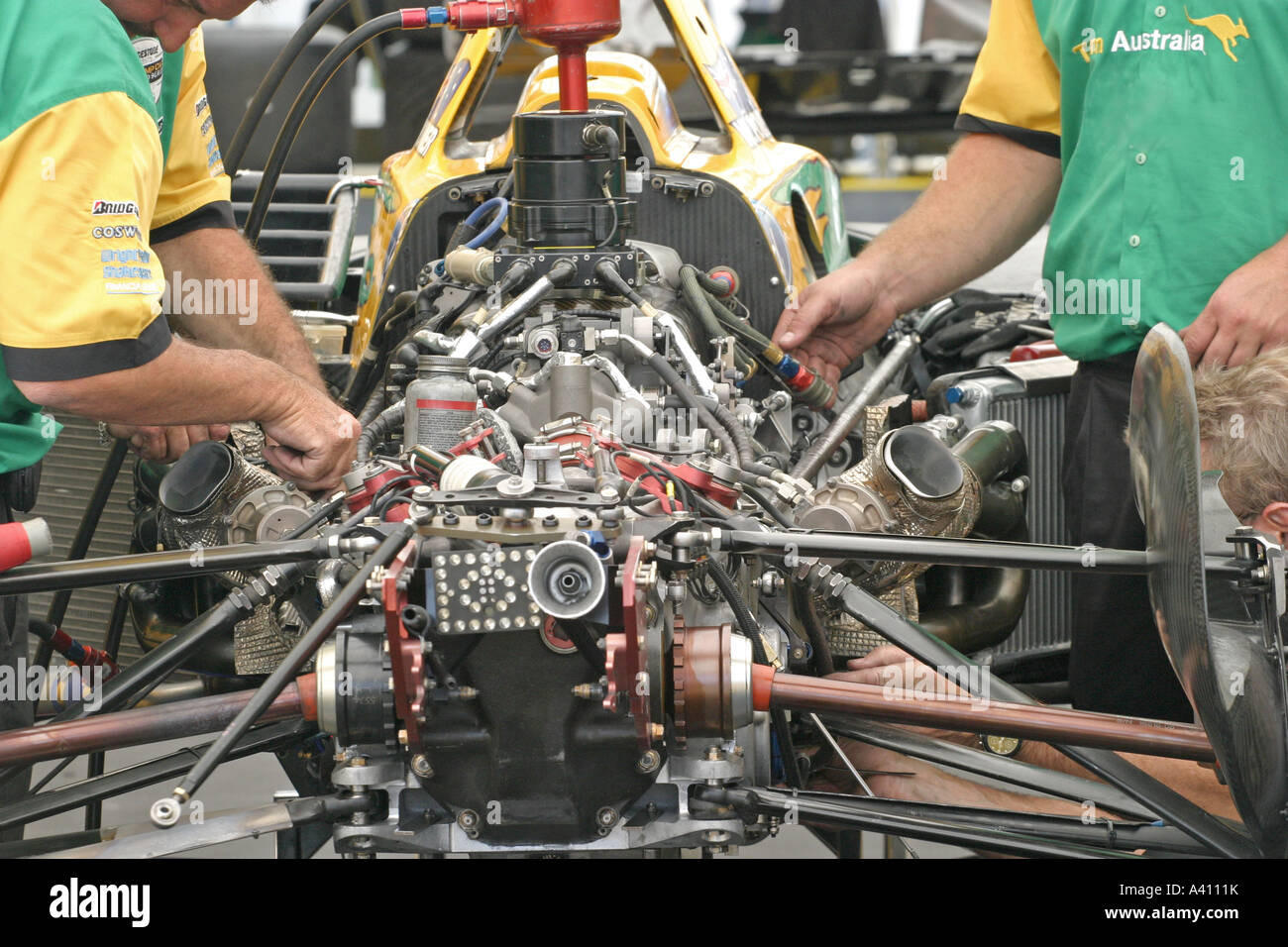 mechanic's hands working on racing car engine Stock Photo - Alamy