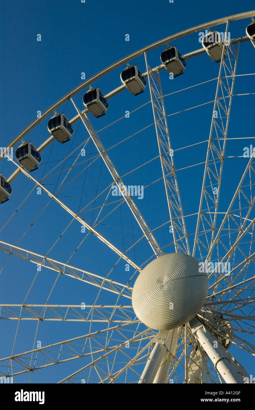 Distorted reflection of the Manchester Wheel in the glass windows of ...