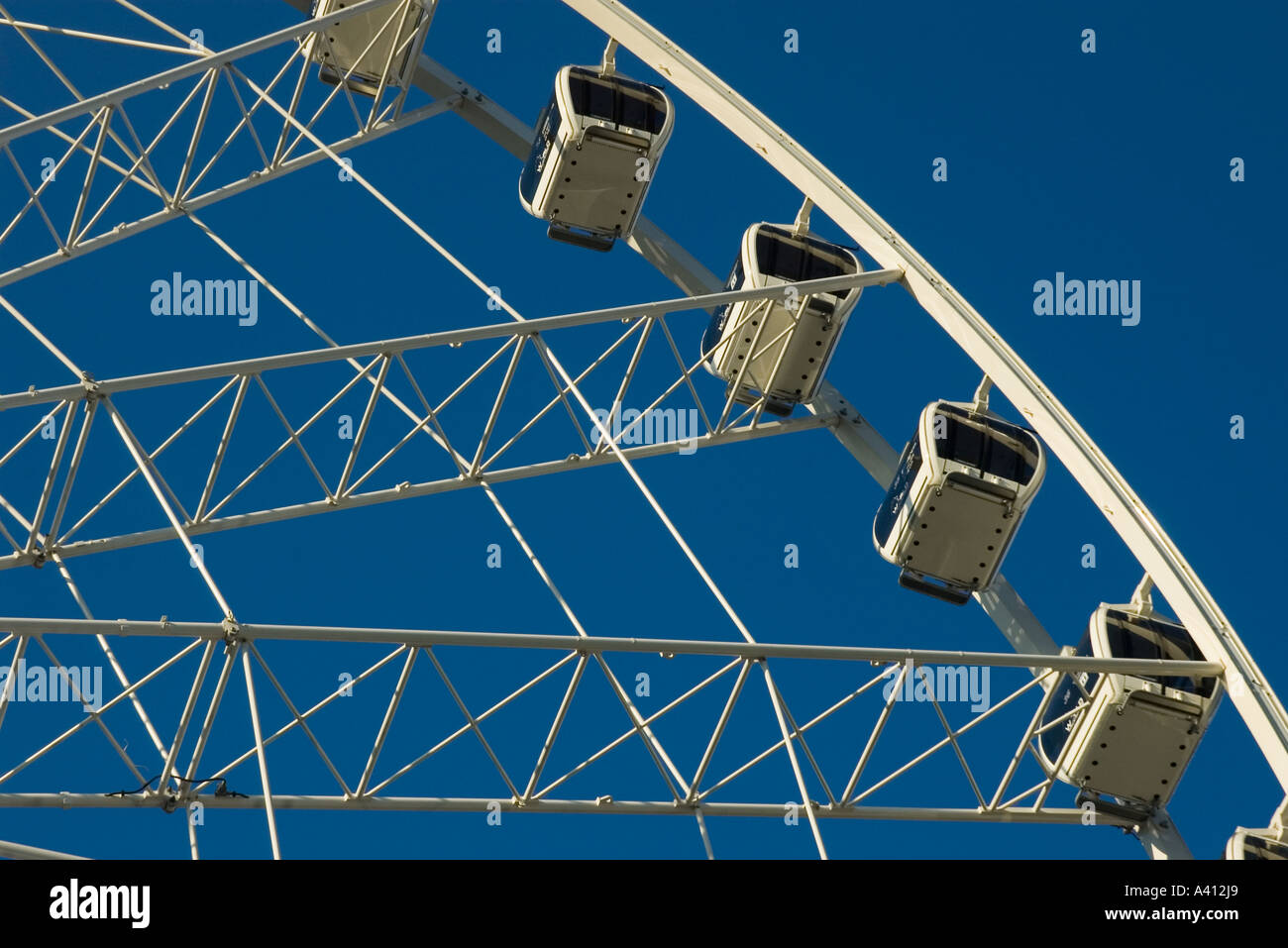 Distorted reflection of the Manchester Wheel in the glass windows of ...