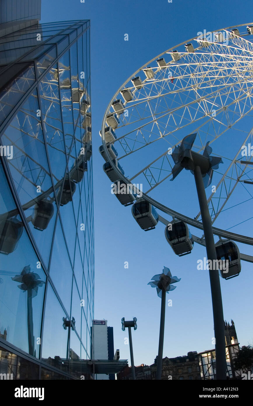Distorted reflection of the Manchester Wheel in the glass windows of ...