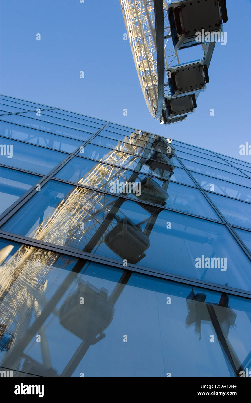 Distorted reflection of the Manchester Wheel in the glass windows of ...