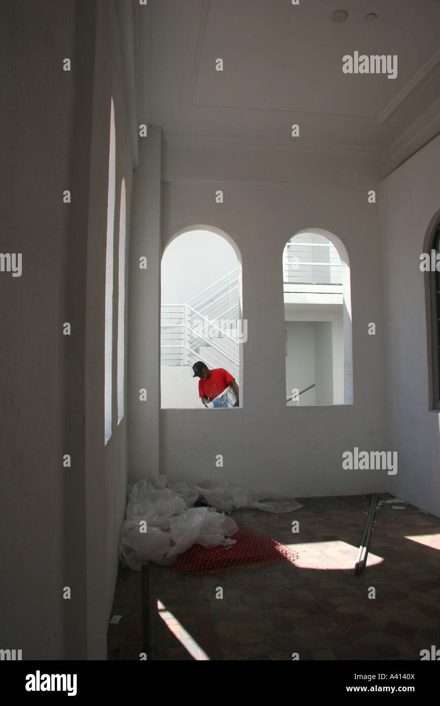 Contraction worker at a white contraction stucco building Stock Photo ...