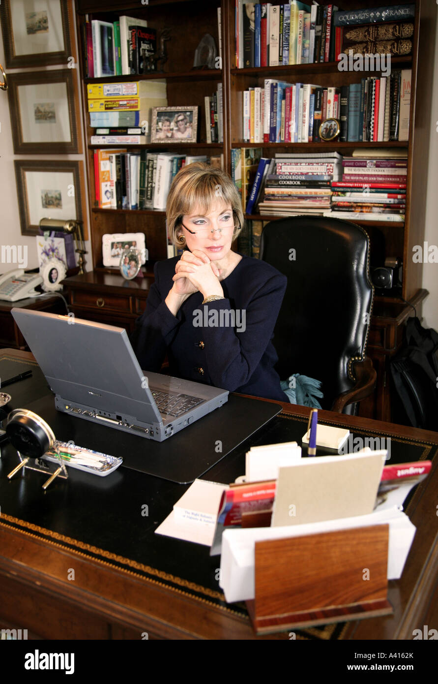 Professional female executive businesswoman sitting at her office desk ...