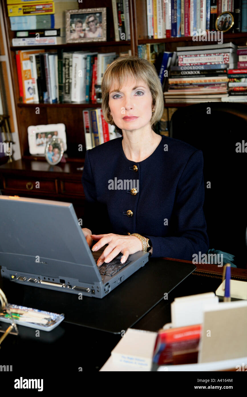 Professional female executive businesswoman sitting at her office desk ...