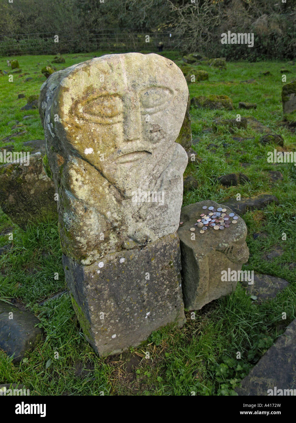 Carved stone figure in Caldragh cemetery Boa Island Lower Lough Erne ...