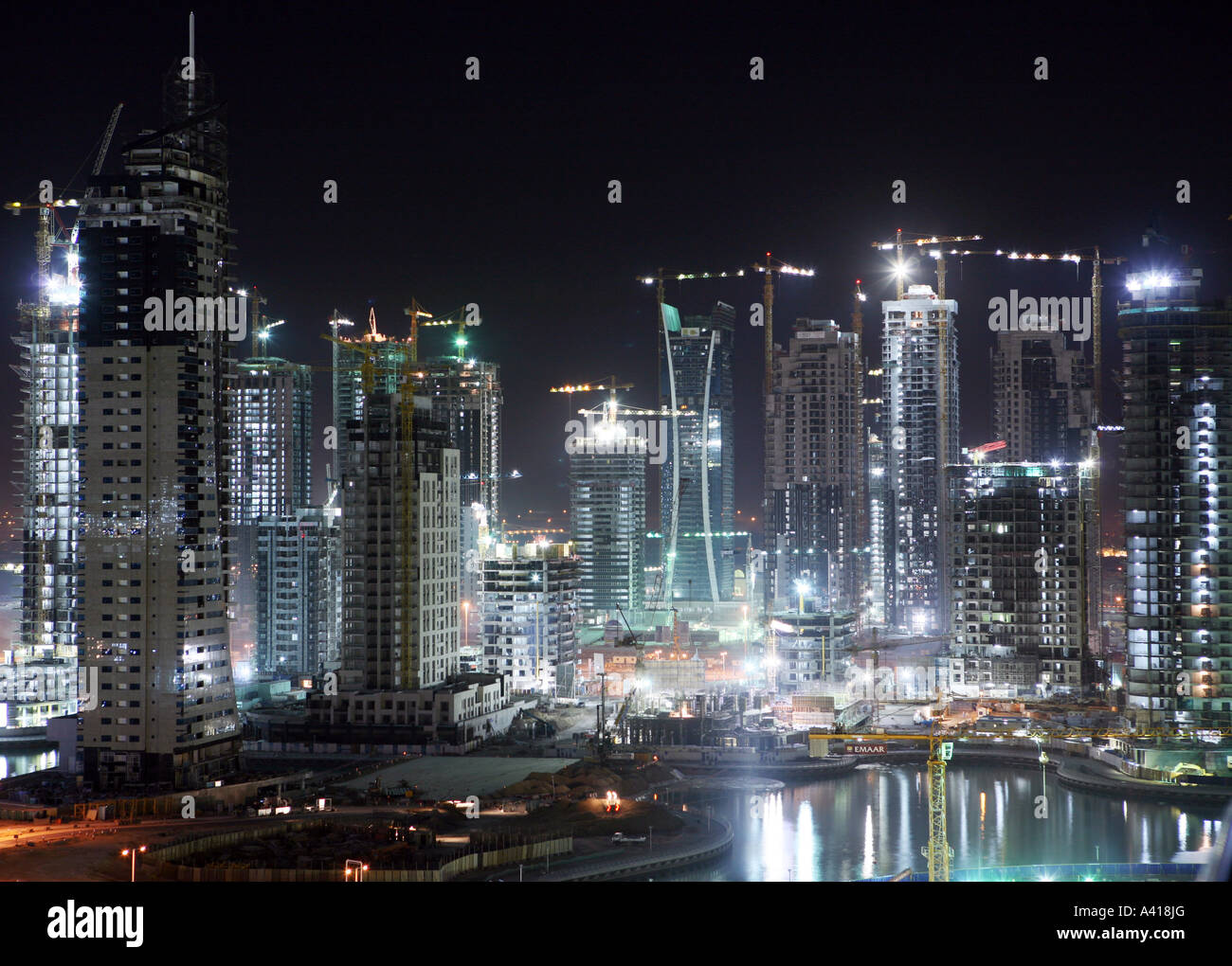 Skyscrapers under construction at night, dubai, UAE. February 2007 ...