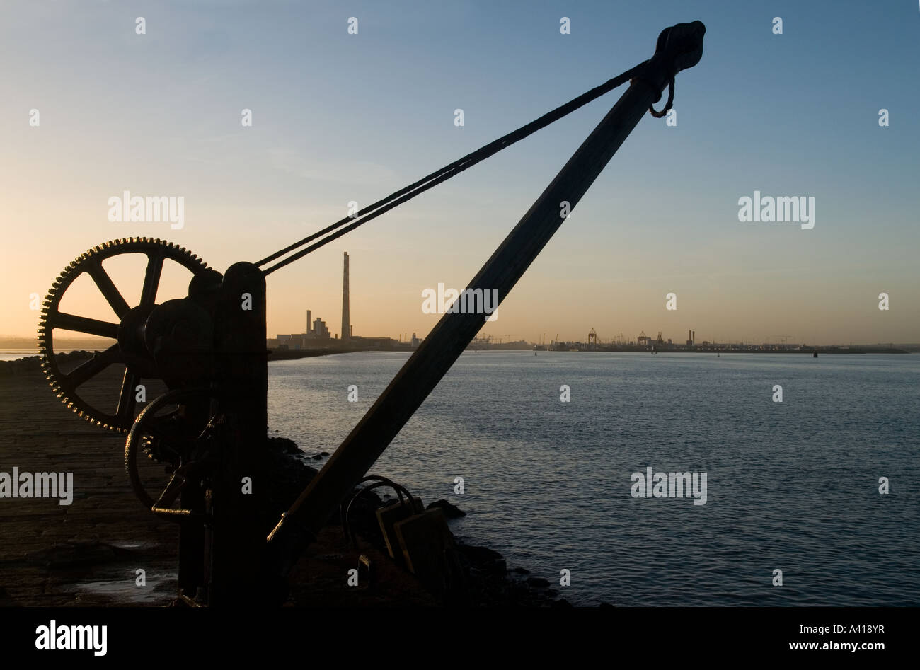 Old harbour crane in Dublin bay framing pool beg cooling towers Stock ...