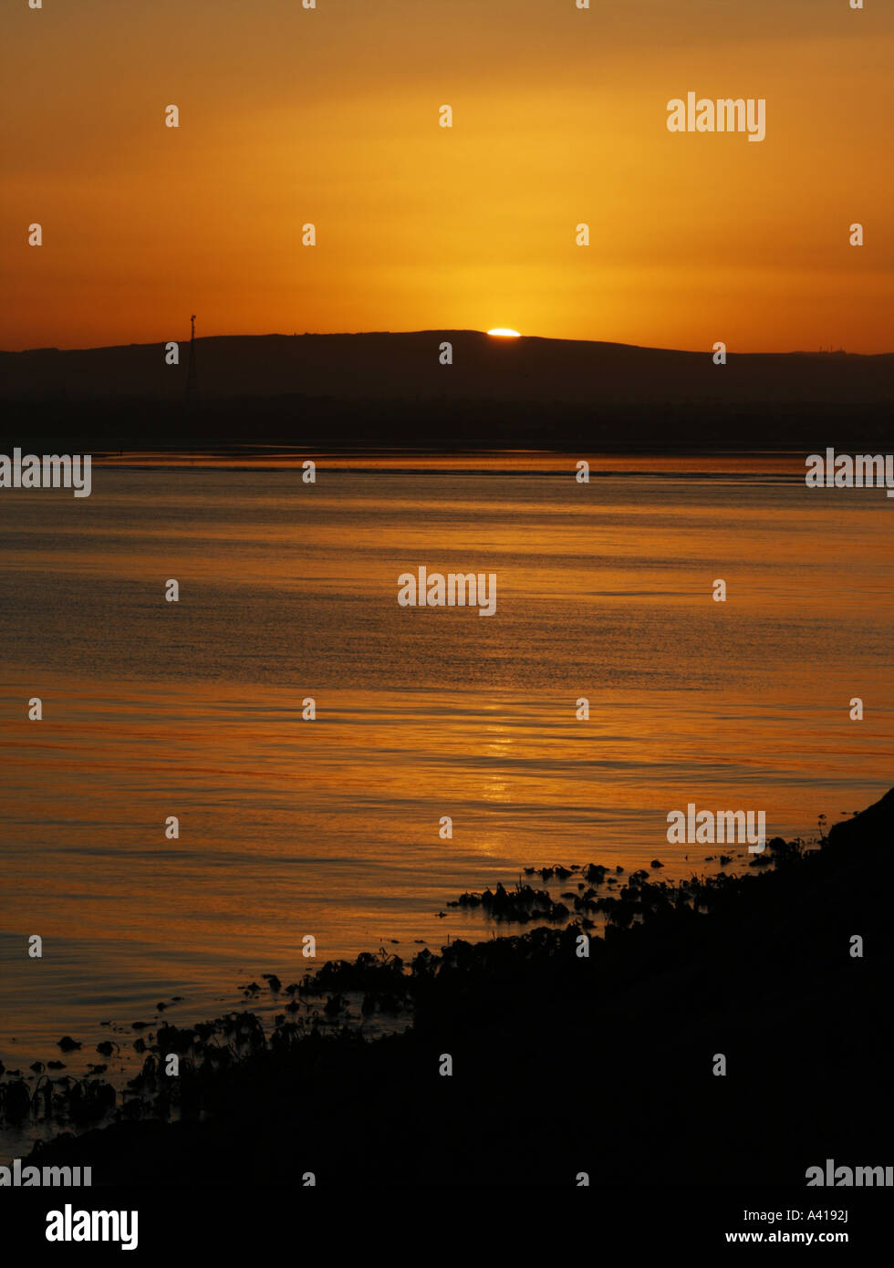 Golden sunset in Sandymount strand in Dublin Ireland Stock Photo - Alamy