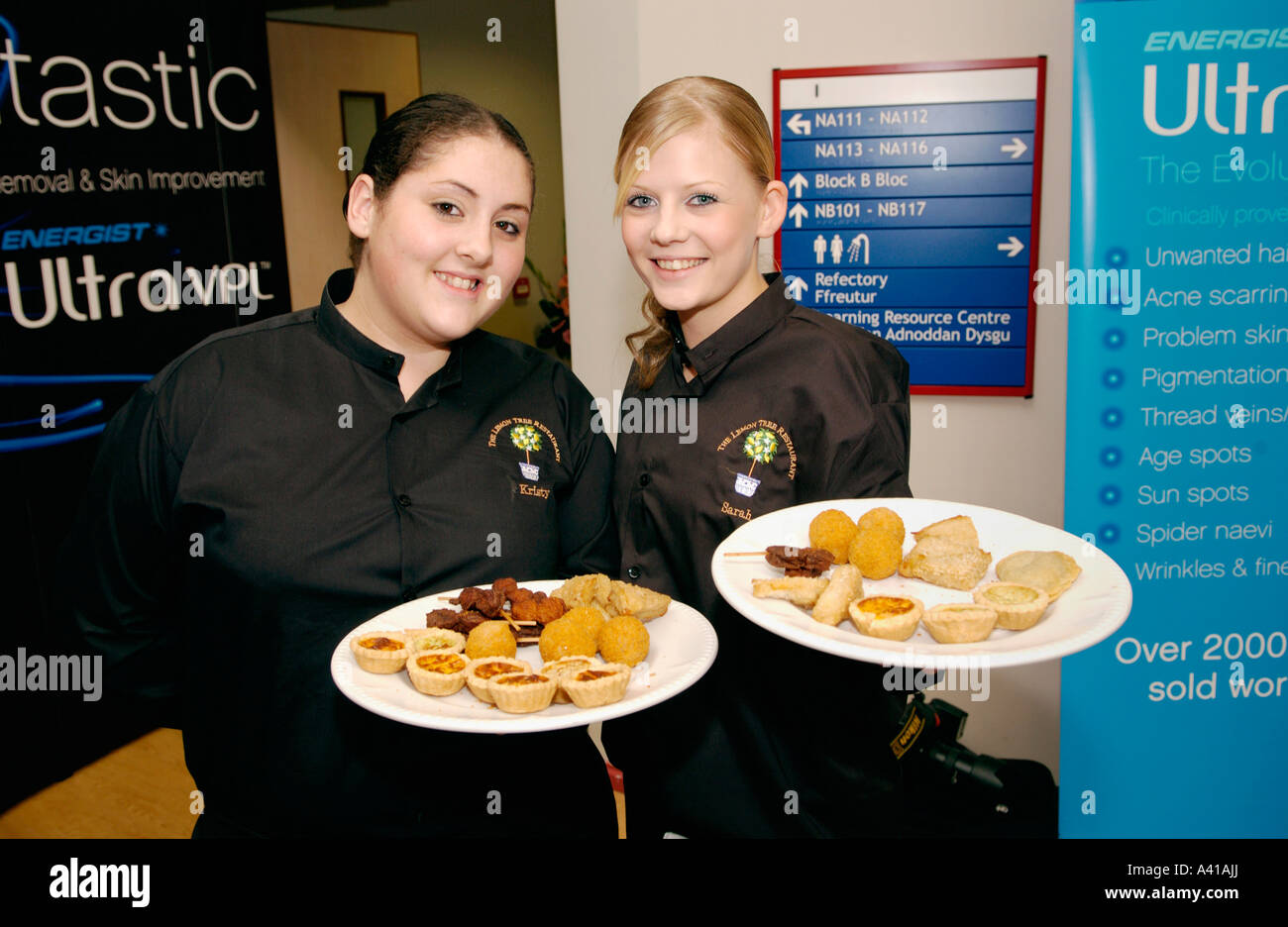 Waitress serving nibbles at a corporate event UK Stock Photo - Alamy
