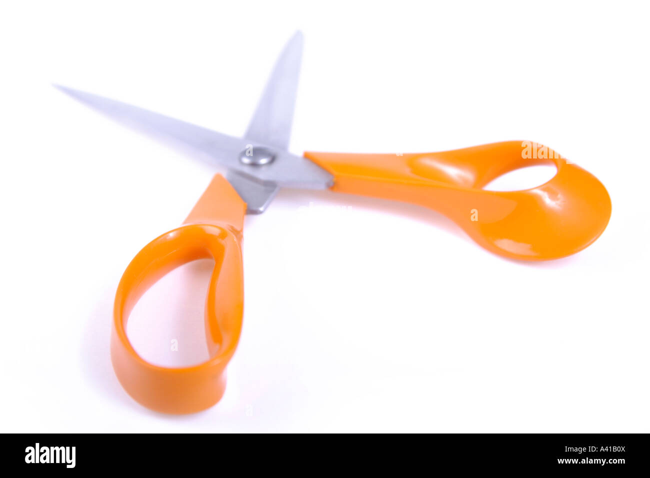 Pair of open scissors on white background with orange handle Stock ...