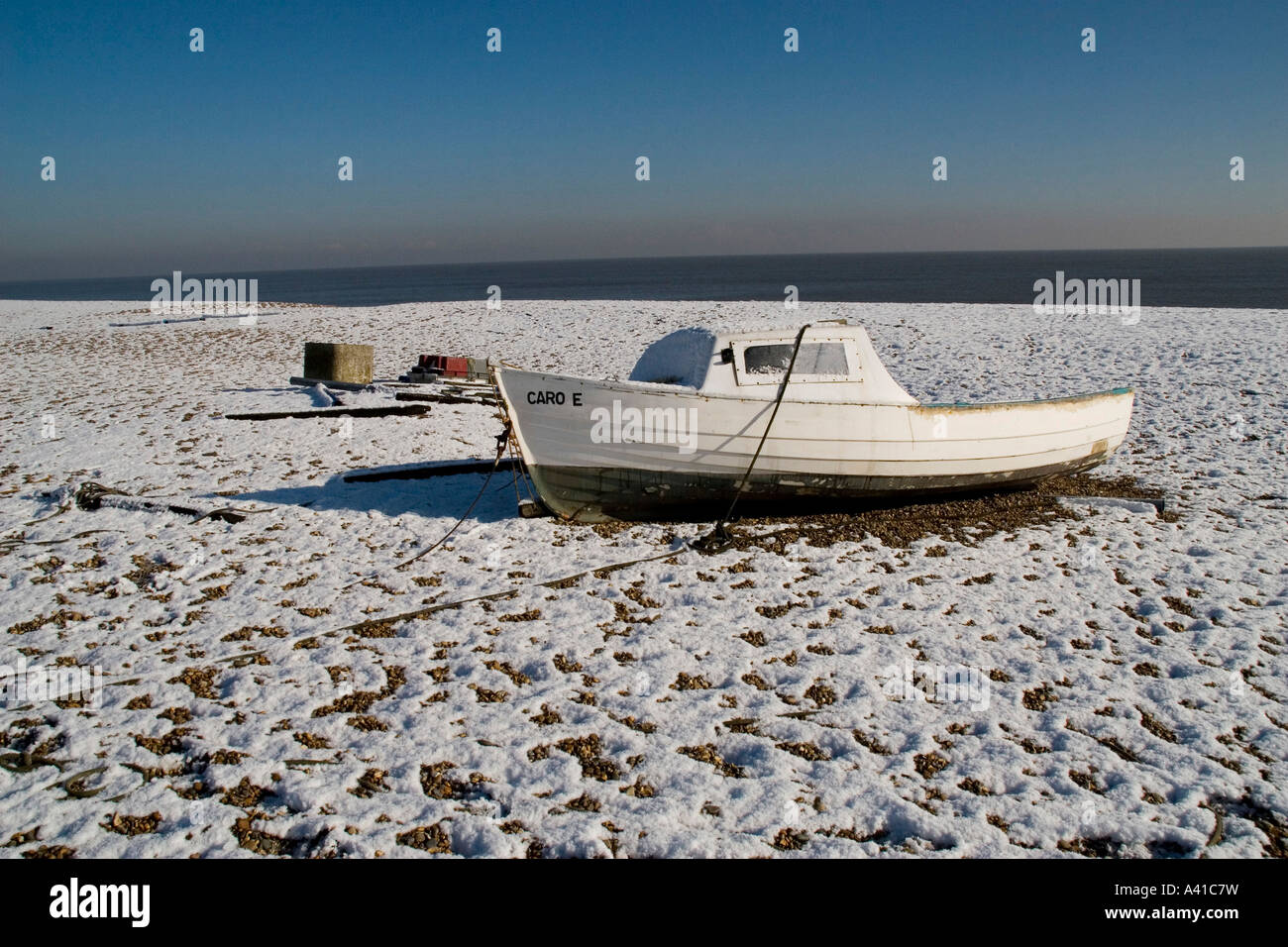 a winters day at Aldeburgh beach shingle covered in snow Stock Photo ...