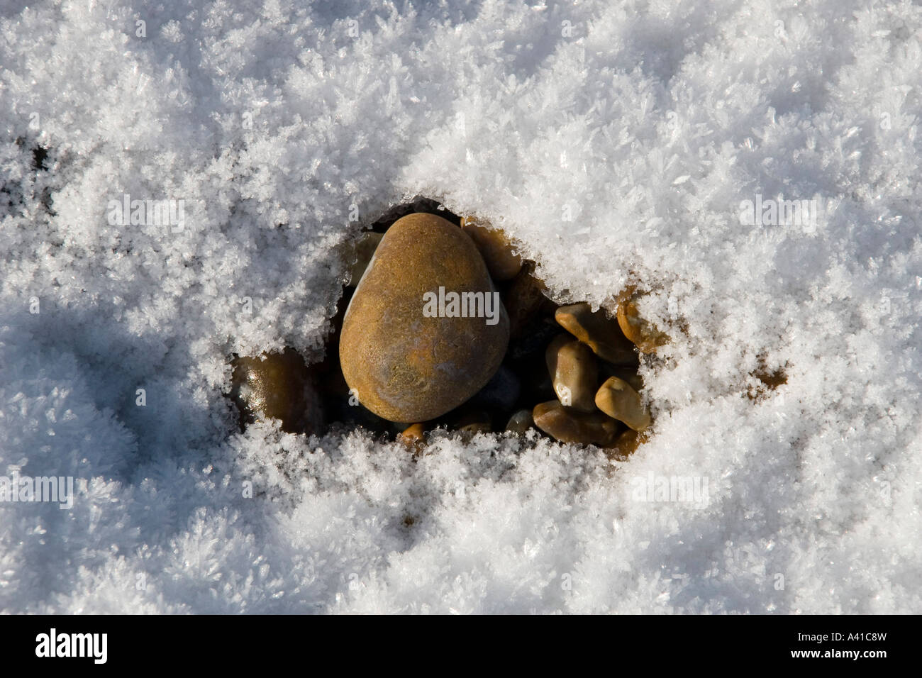 snow covered pebbles on aldeburgh beach Stock Photo - Alamy