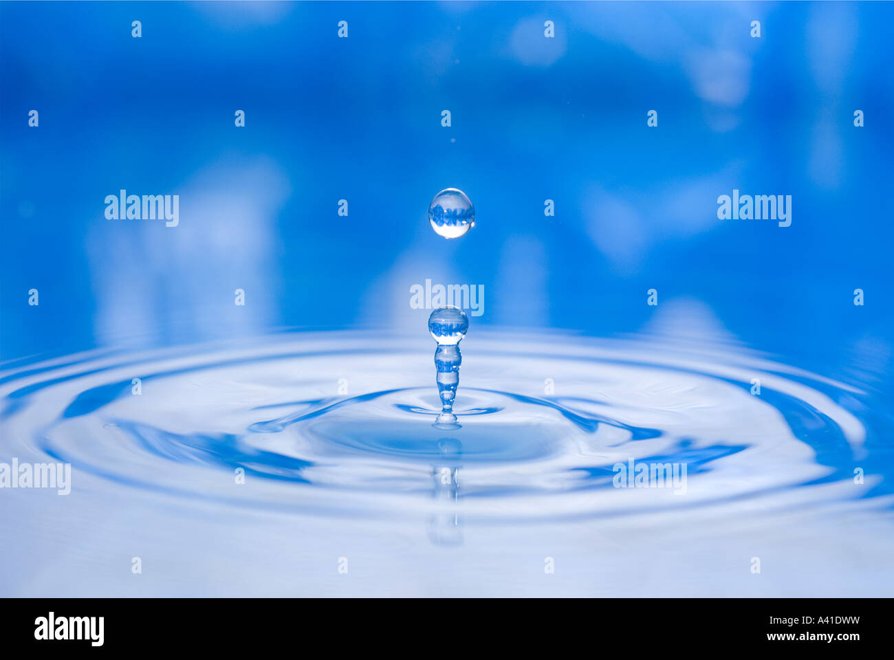 blue water and jumping waterdrop Stock Photo - Alamy